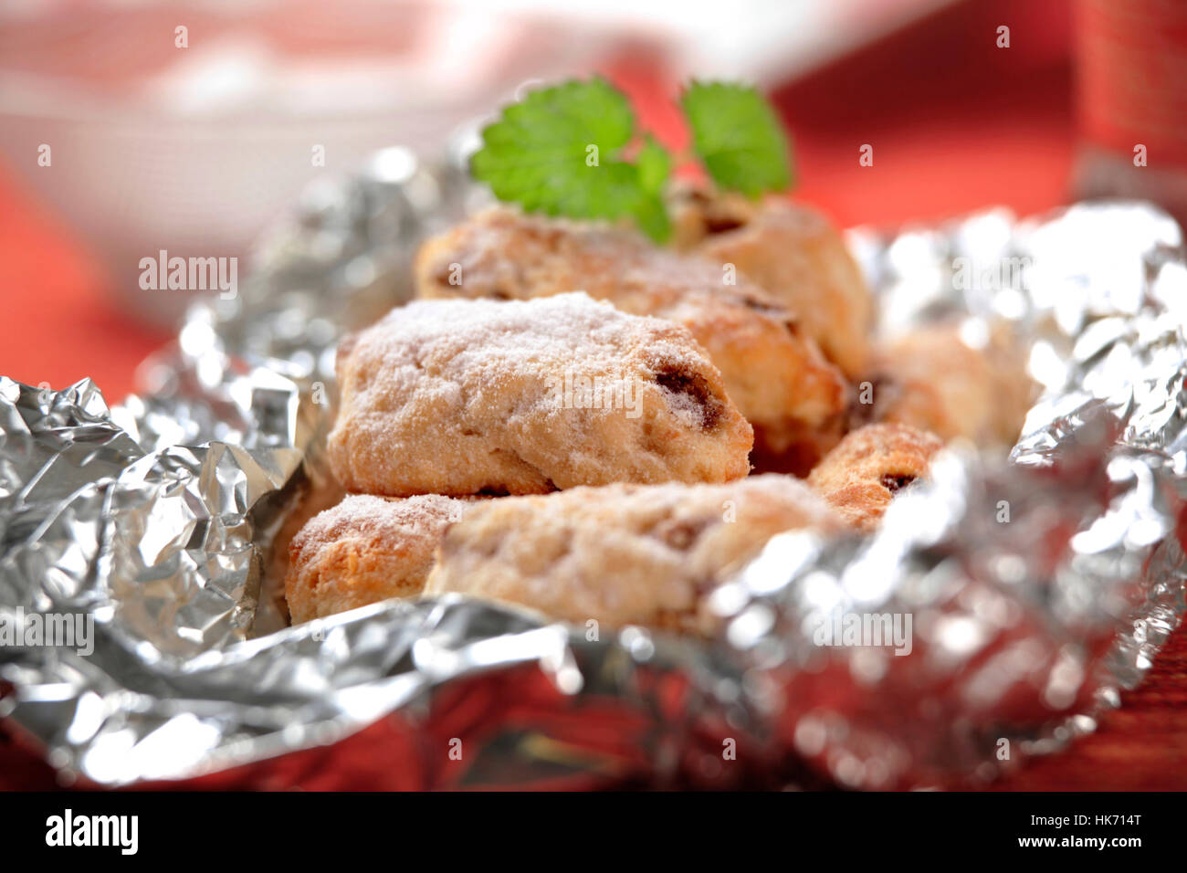Mini Christmas stollen cakes in aluminum foil Stock Photo - Alamy