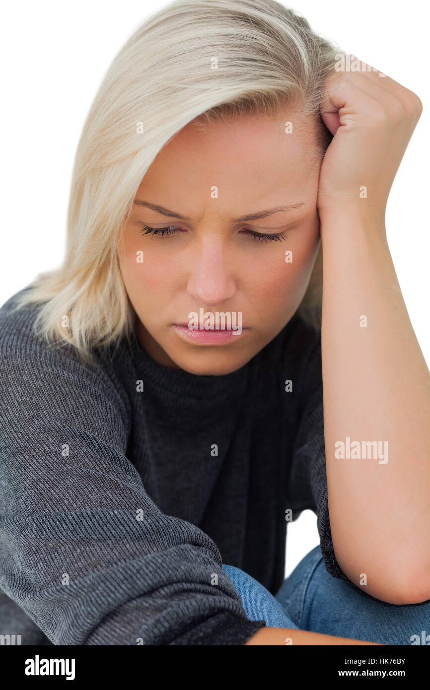 Portrait of a woman looking anxious on white background Stock Photo - Alamy