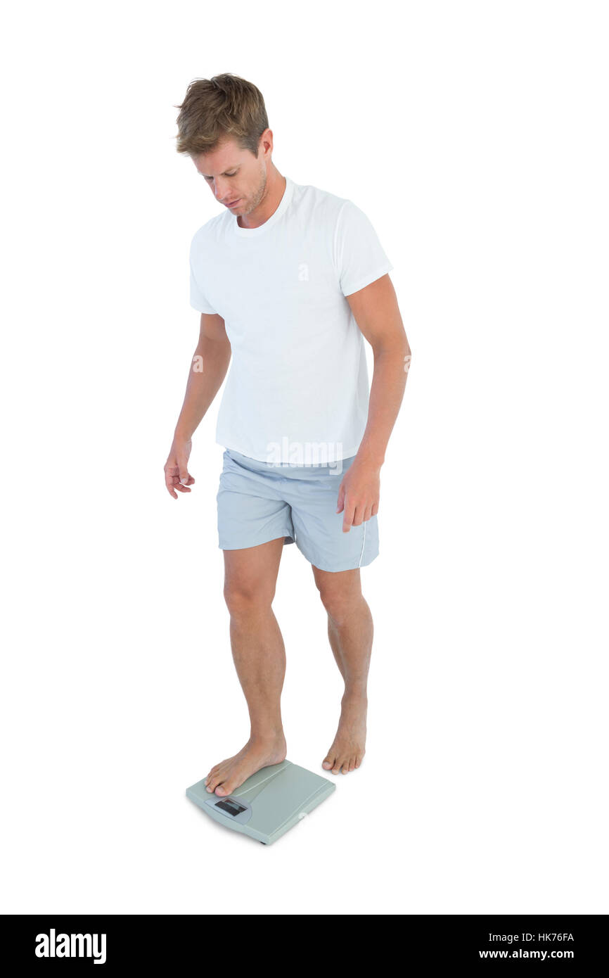 Man weighing scales Cut Out Stock Images & Pictures - Alamy