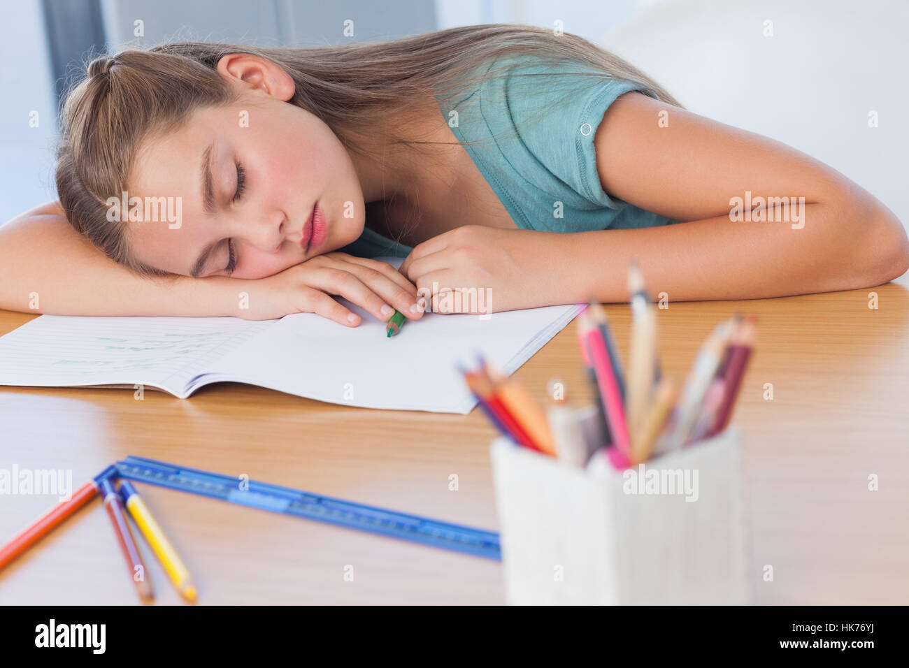 Cute girl sleeping on desk hi-res stock photography and images - Alamy