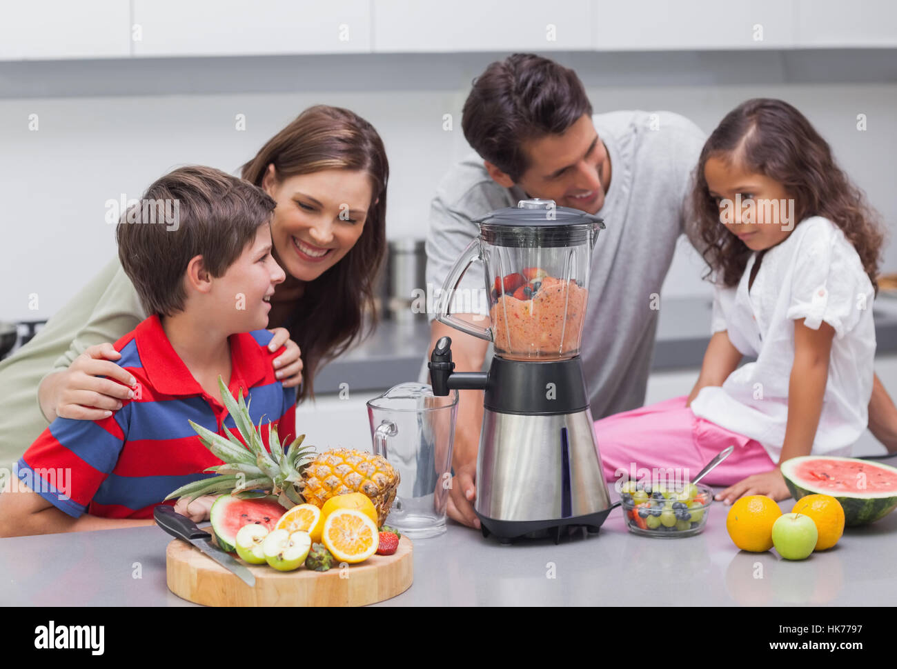 Family using a blender in the kitchen Stock Photo - Alamy