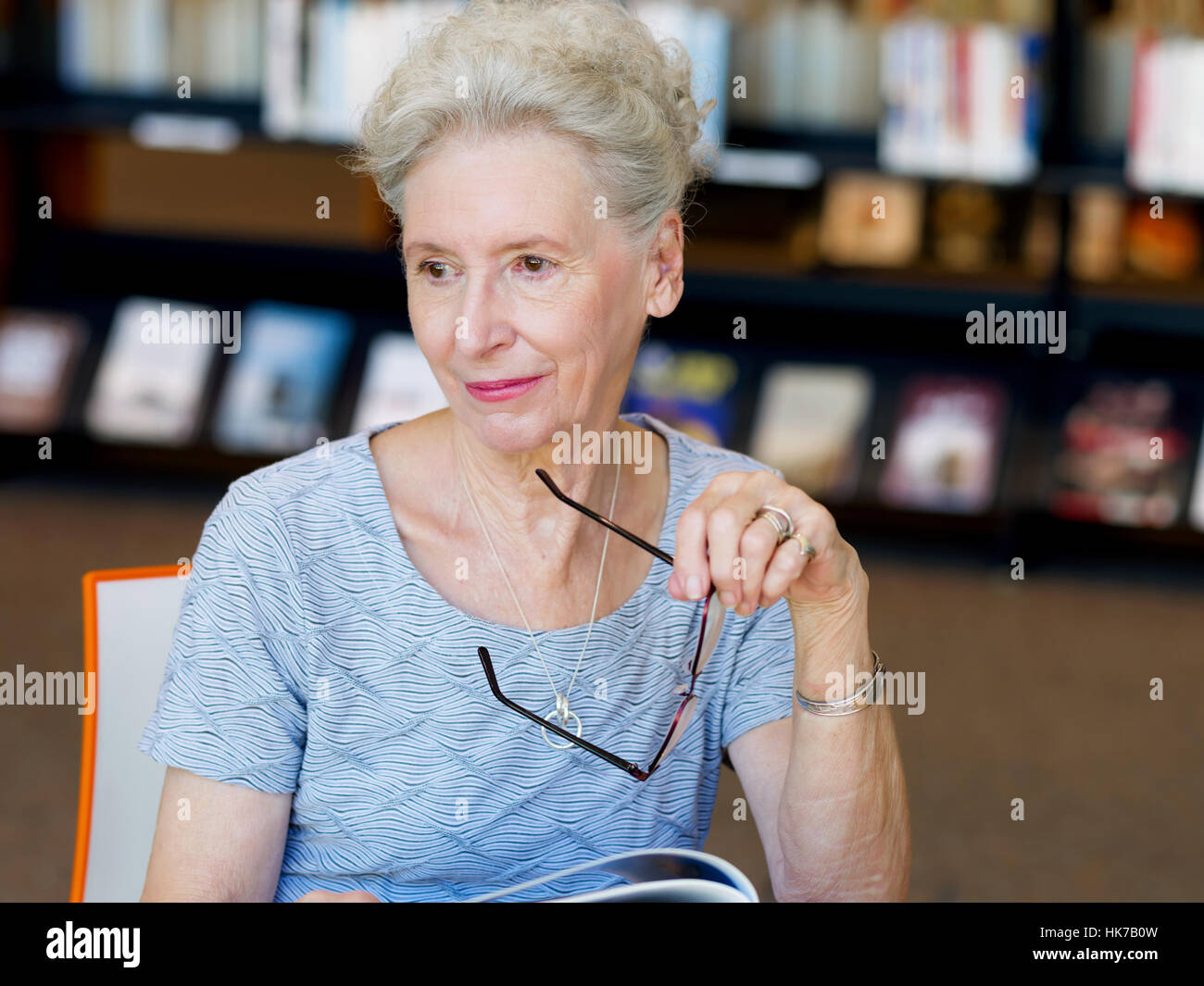 Elderly scholar holding hi-res stock photography and images - Alamy