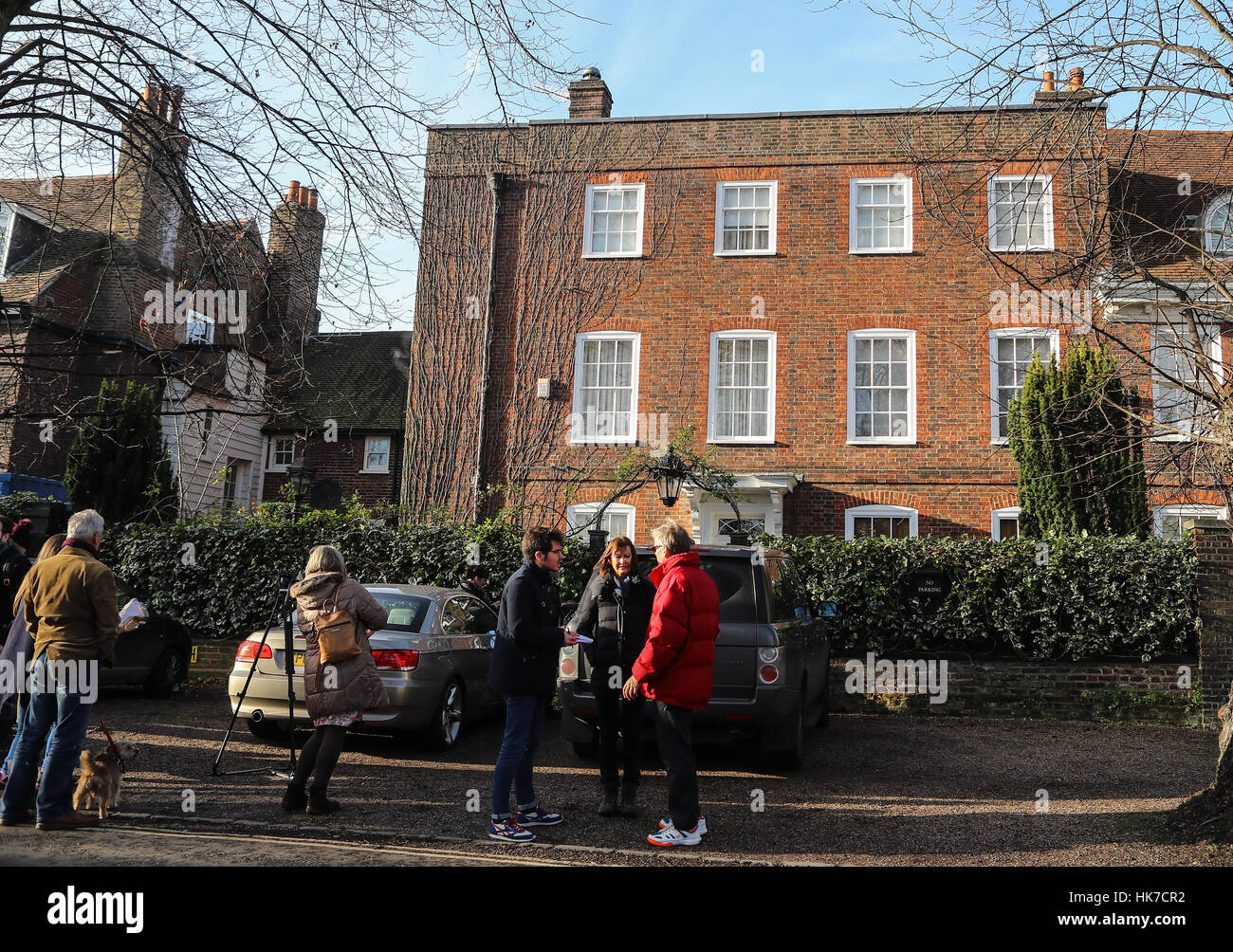 People leave candles and floral tributes outside the Highgate home of ...