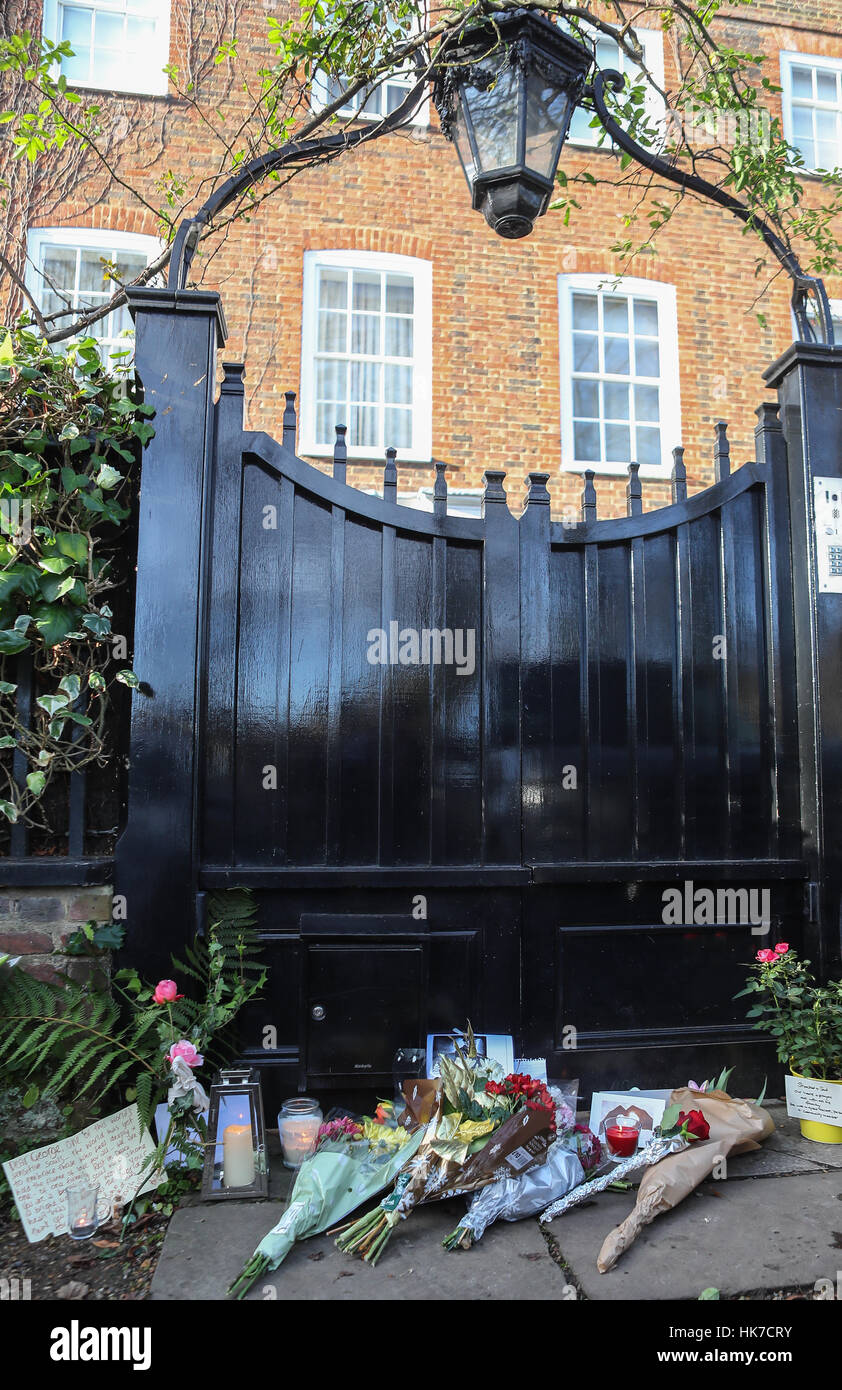 People leave candles and floral tributes outside the Highgate home of ...