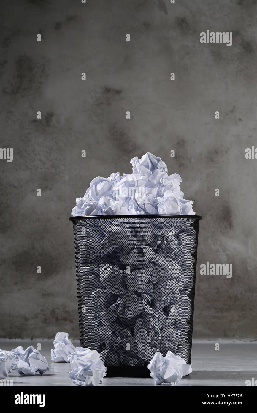 Concept. Creased paper in a trash can Stock Photo - Alamy
