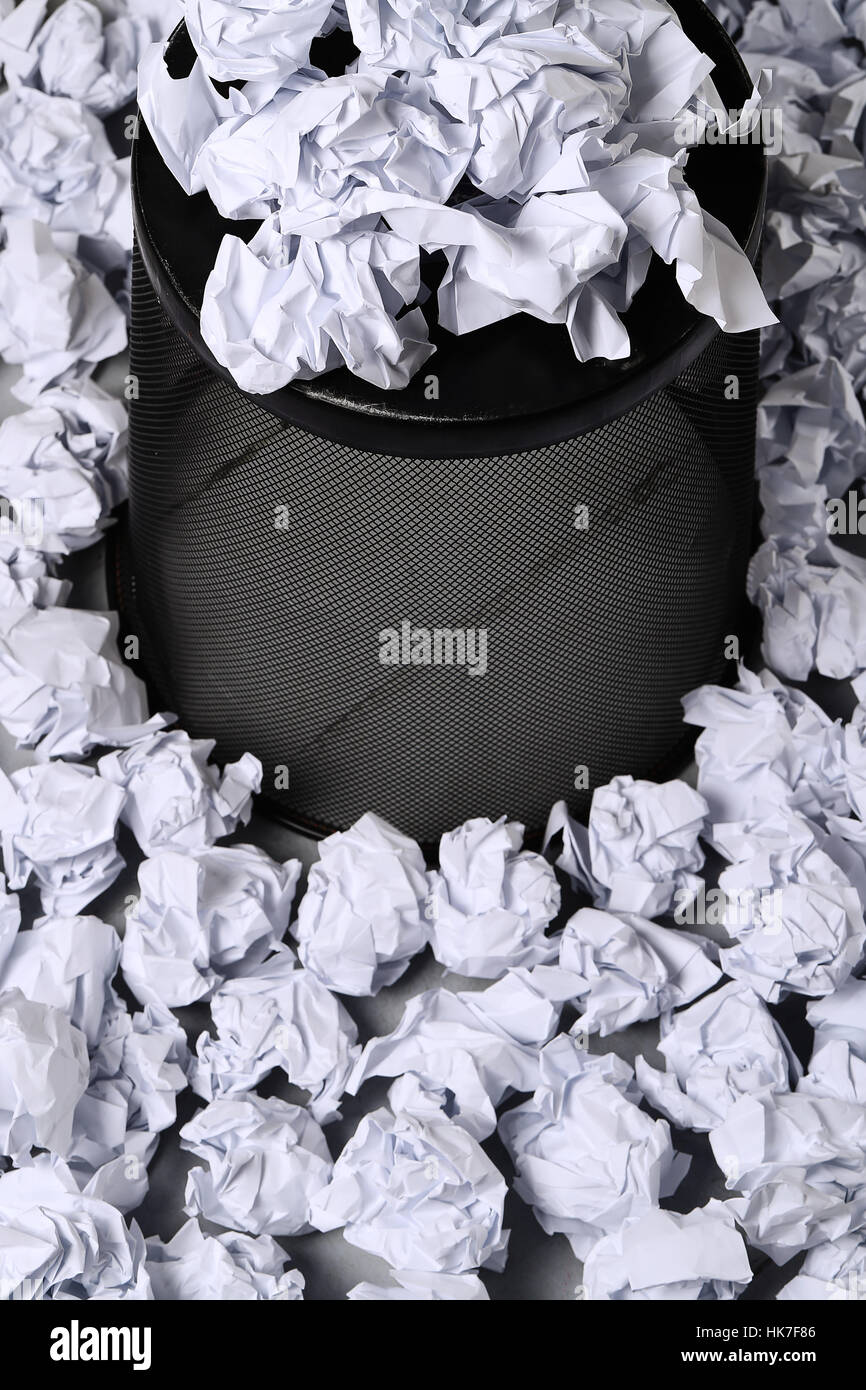 Concept. Creased paper in a trash can Stock Photo - Alamy