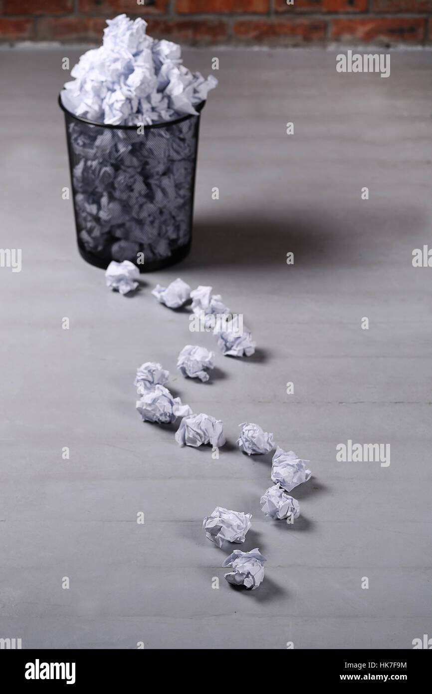 Concept. Creased paper in a trash can Stock Photo - Alamy