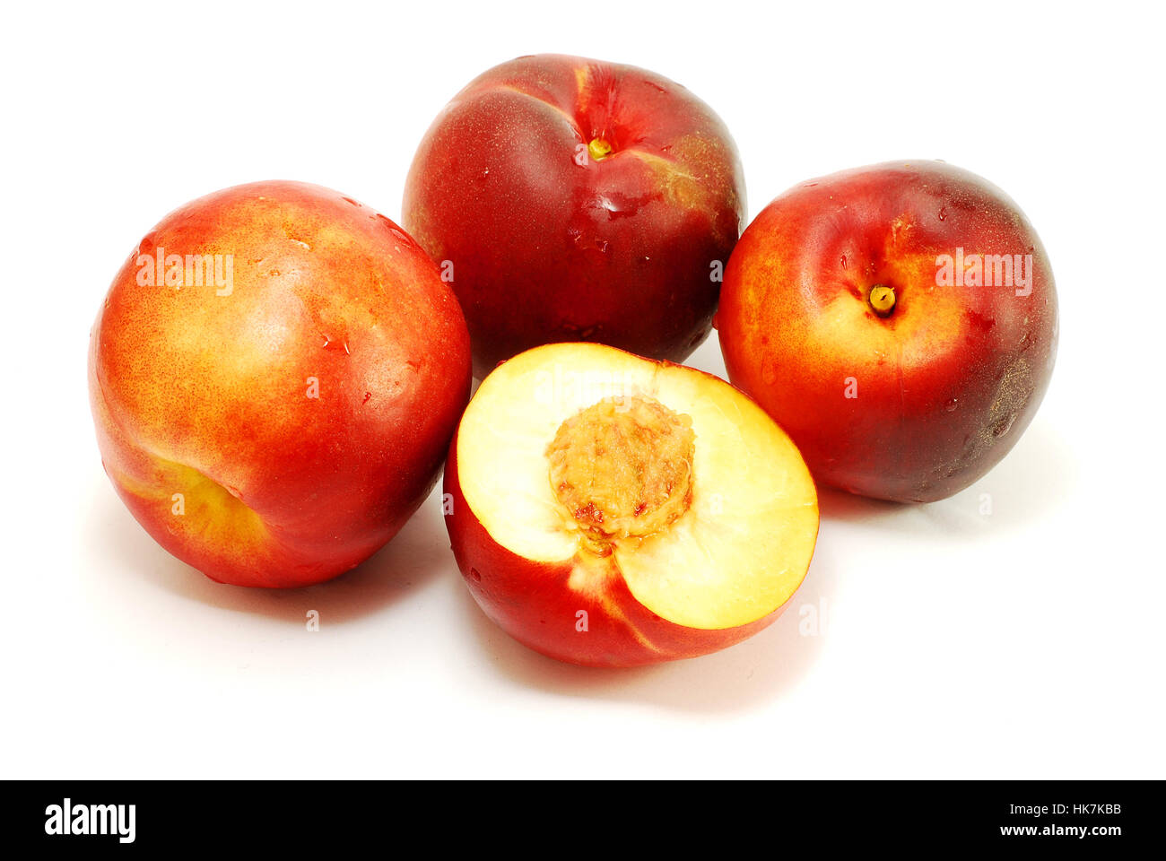 Ripe red peaches isolated Stock Photo - Alamy