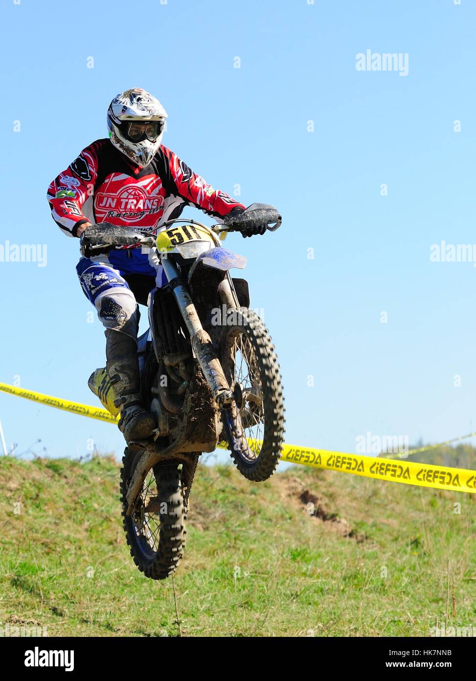 Unidentified rider riding the motorbike on field during European enduro ...