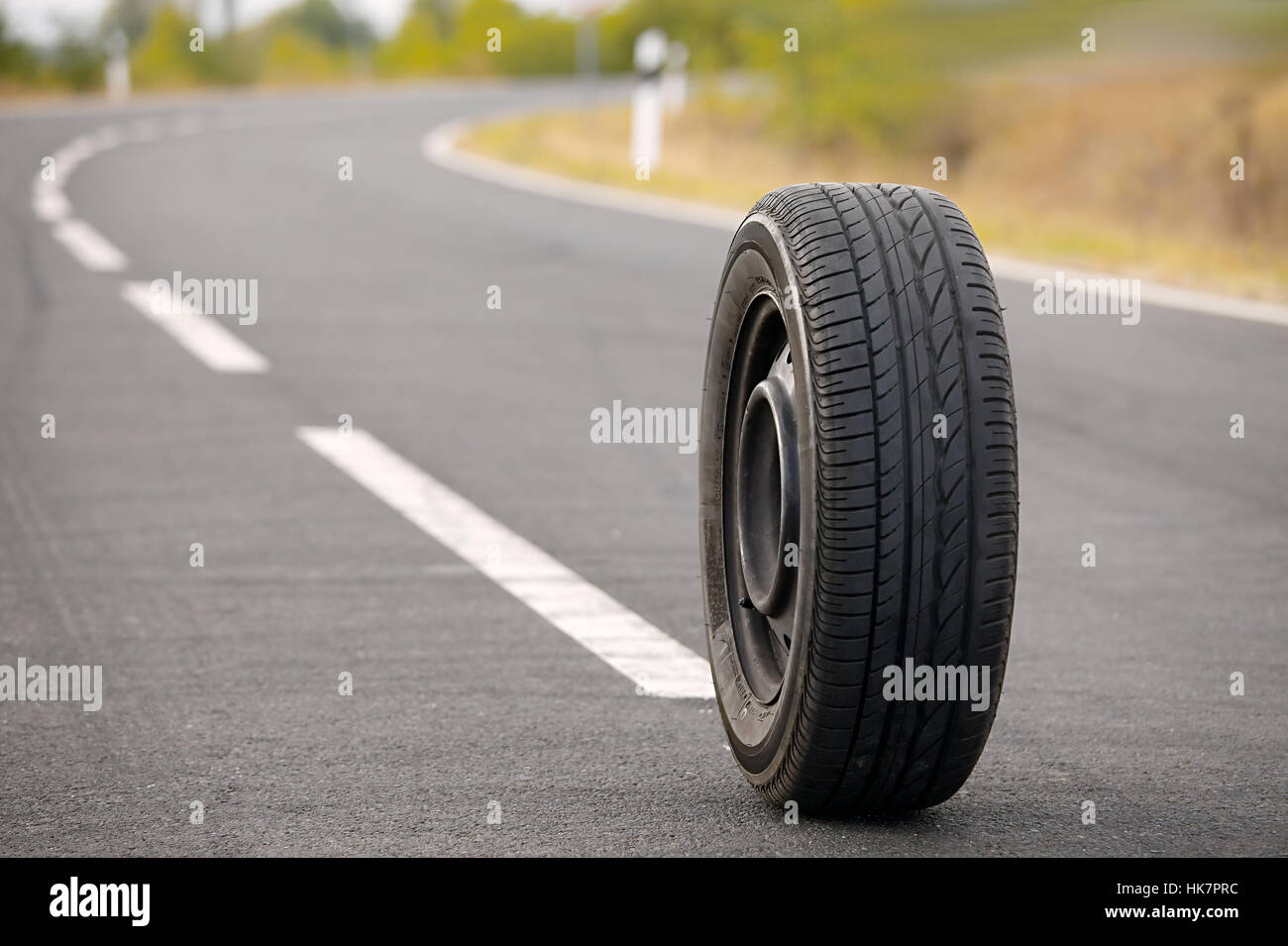 Wheel of a car on a road Stock Photo - Alamy