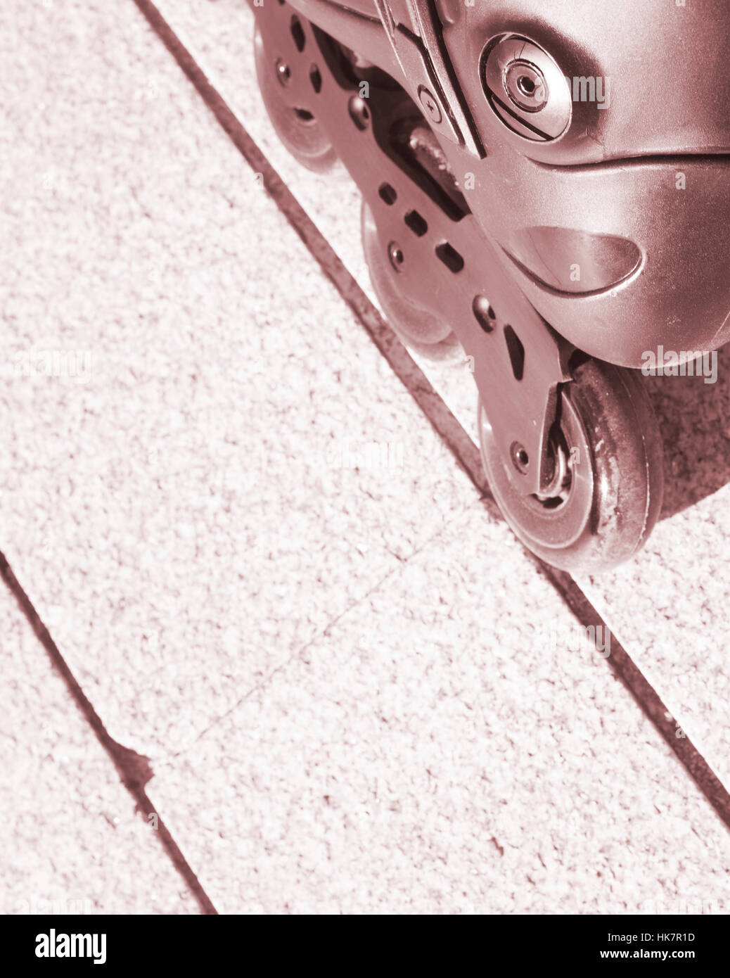 Inline freestyle roller blade skates in street on road surface skating ...
