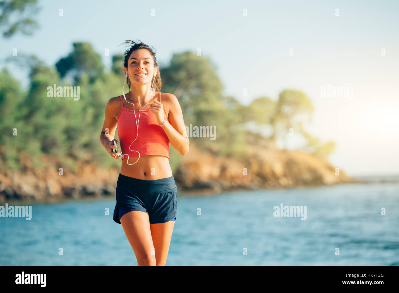 Woman running beach beach hi-res stock photography and images - Alamy