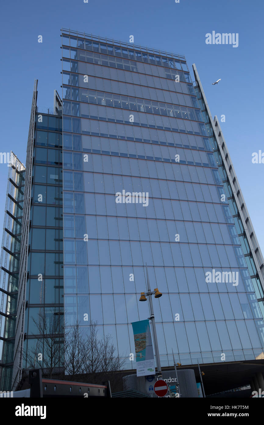 A small glass fronted building next to the Shard in London Stock Photo ...