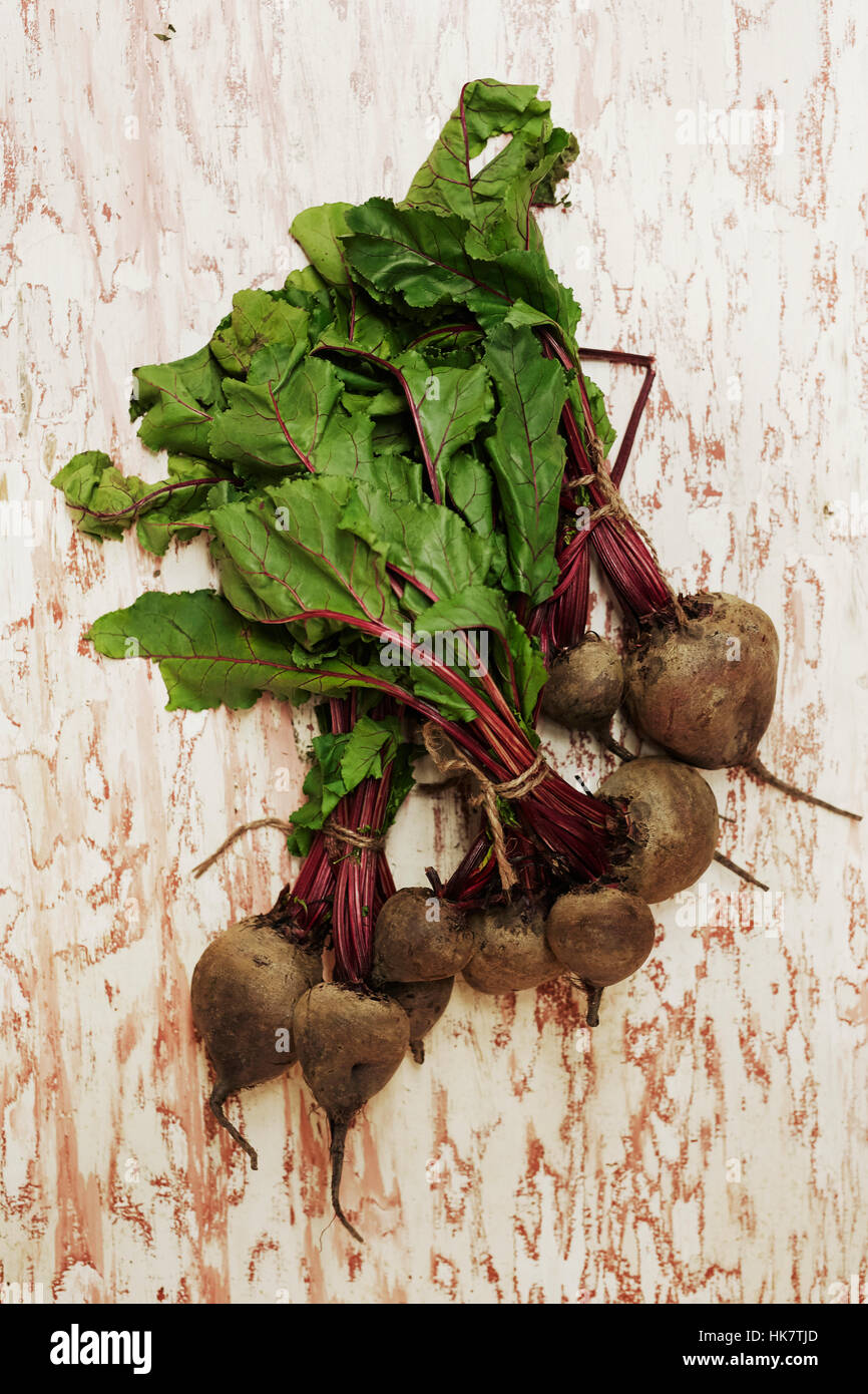A shot of bundles of beets on a wooden surface, seen from above Stock ...