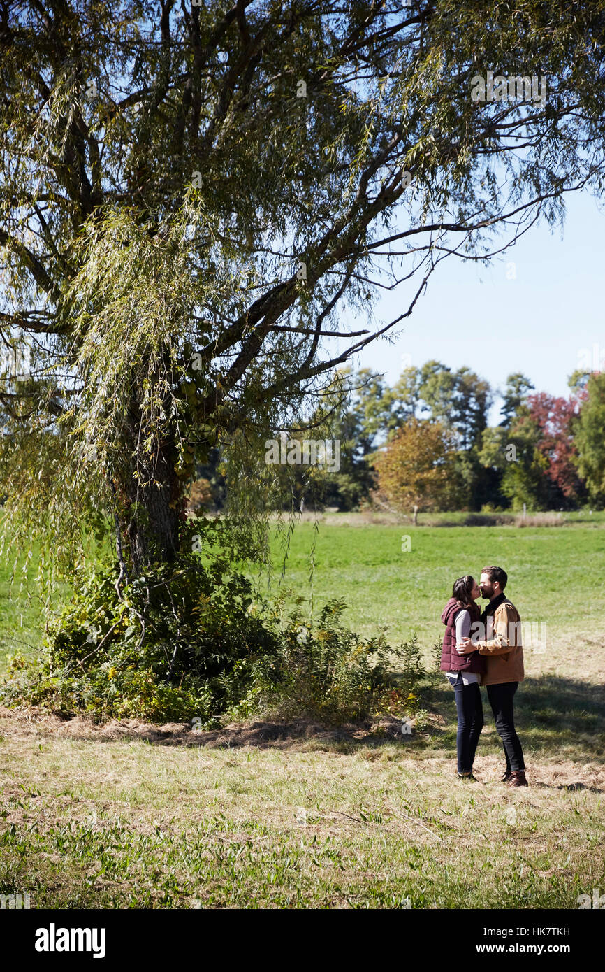 Man standing next tree hi-res stock photography and images - Alamy