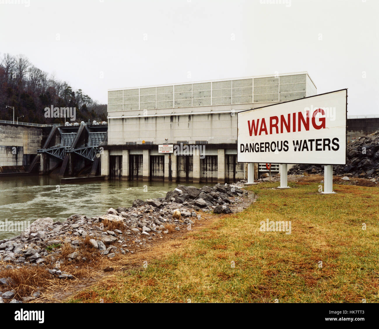 Warning signs by a water channel, Dangerous Waters. A covered bridge ...