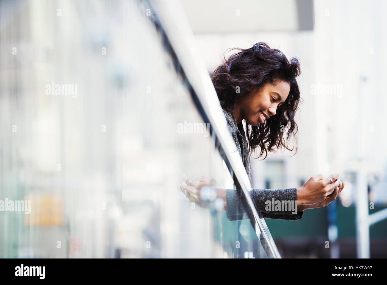 Leaning over rail hi-res stock photography and images - Alamy