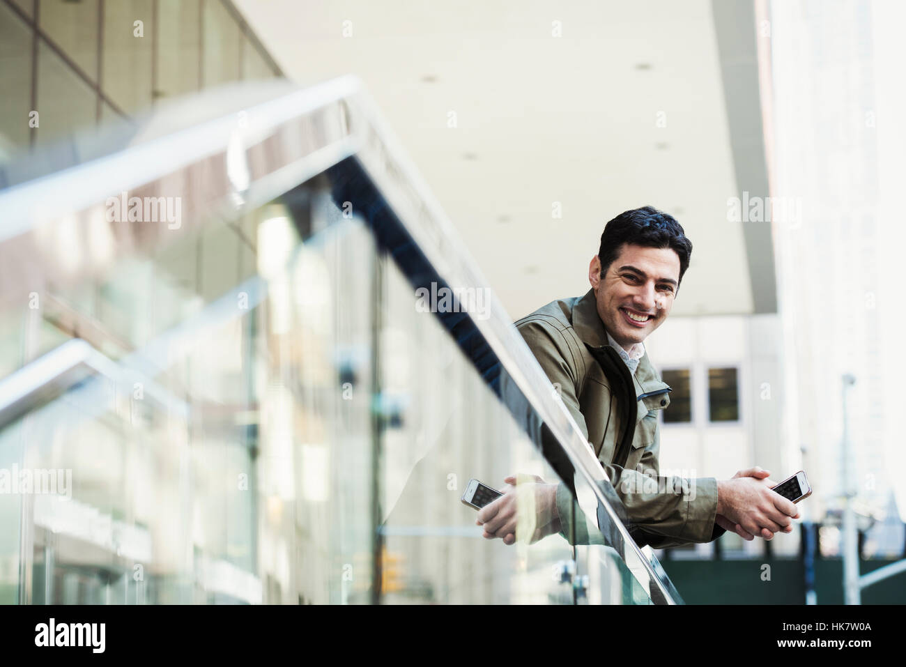 Leaning over rail hi-res stock photography and images - Alamy