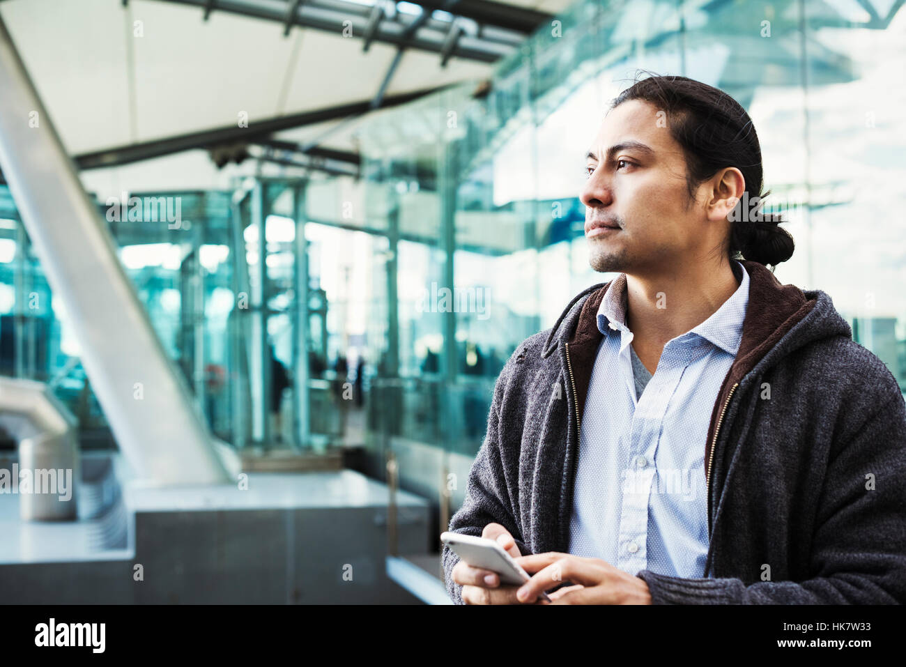 Hispanic man holding phone horizontal hi-res stock photography and ...