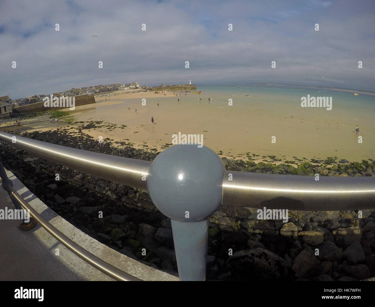 Fisheye lens view over a wall railings to st ives harbour beach. St ...