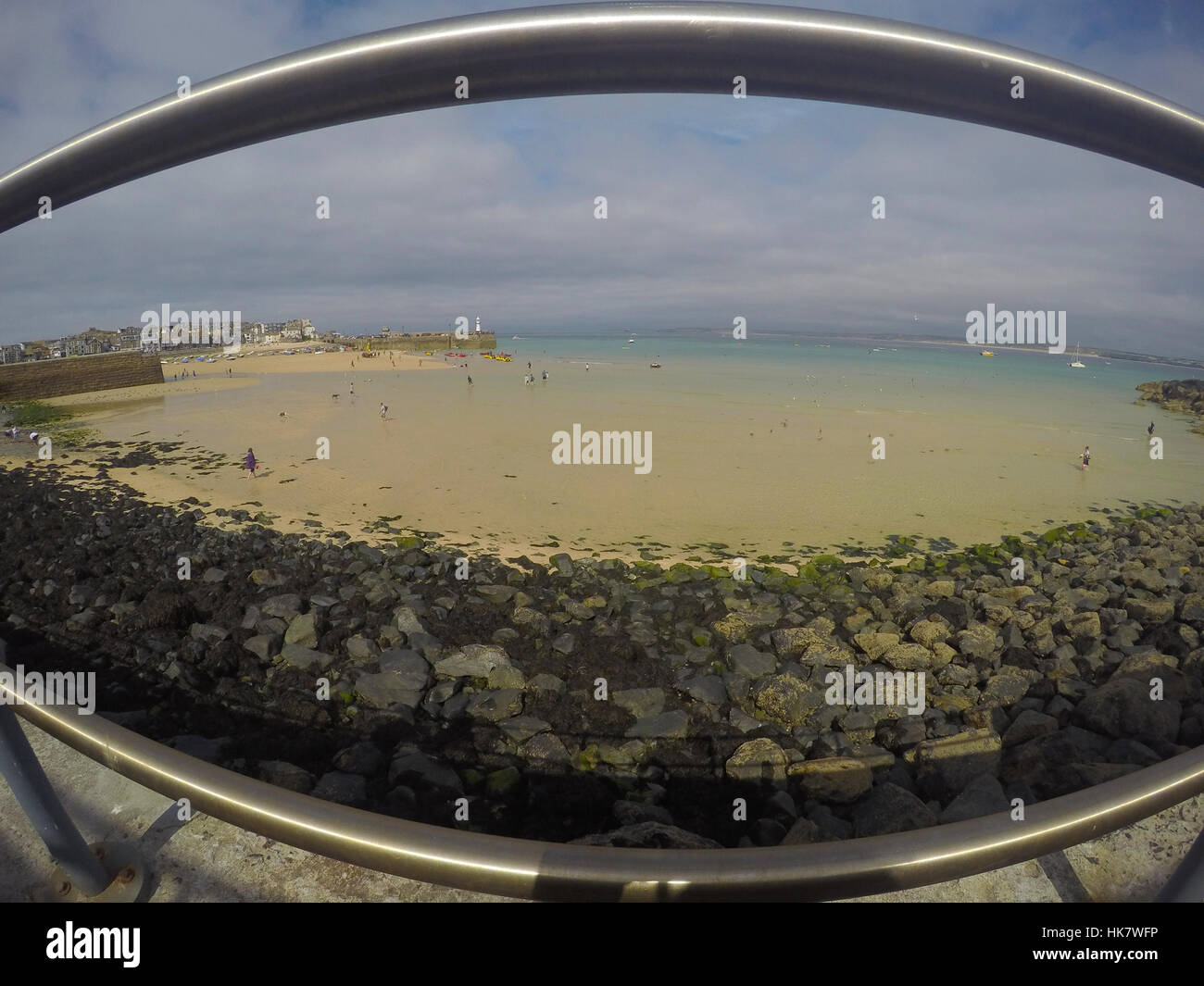 Fisheye lens view over a wall railings to st ives harbour beach. St ...