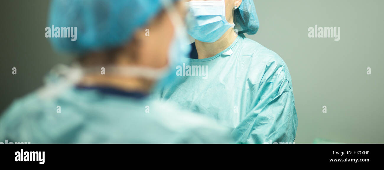 Surgeon in hospital surgery in sterile uniform "scrubs" in operating ...