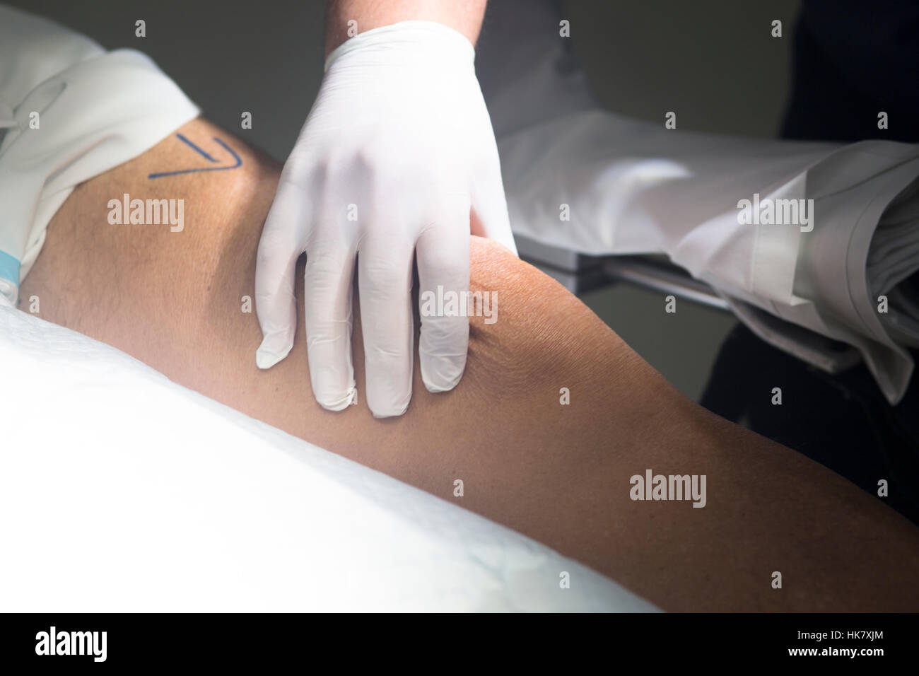 Patient leg in operating theater with surgical bandage in hospital ...