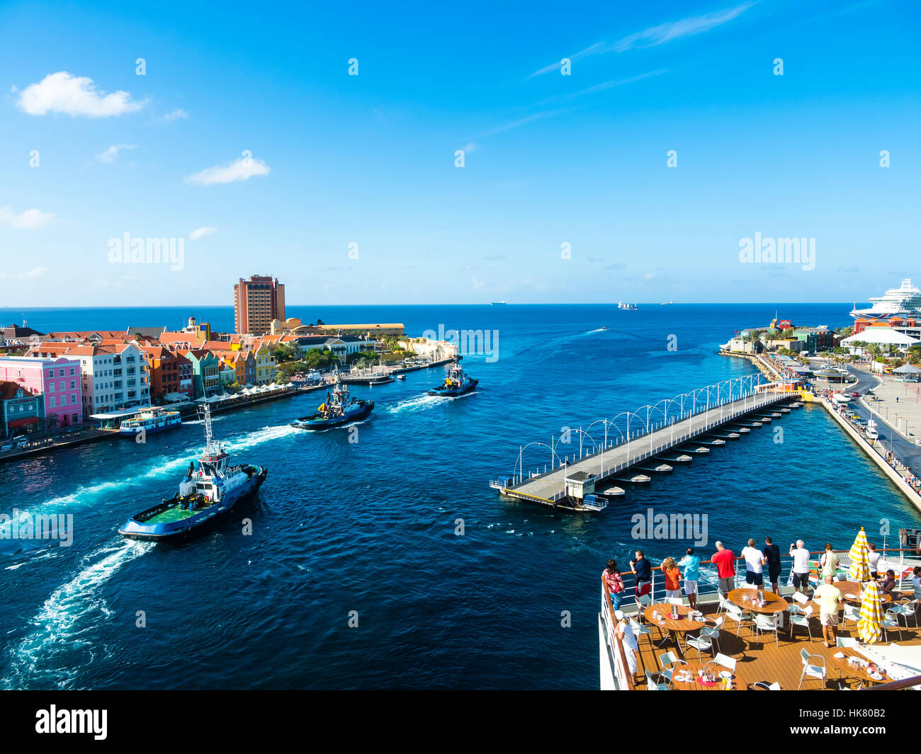 Tugboat, colorful row of houses in Punda district at back, commercial ...