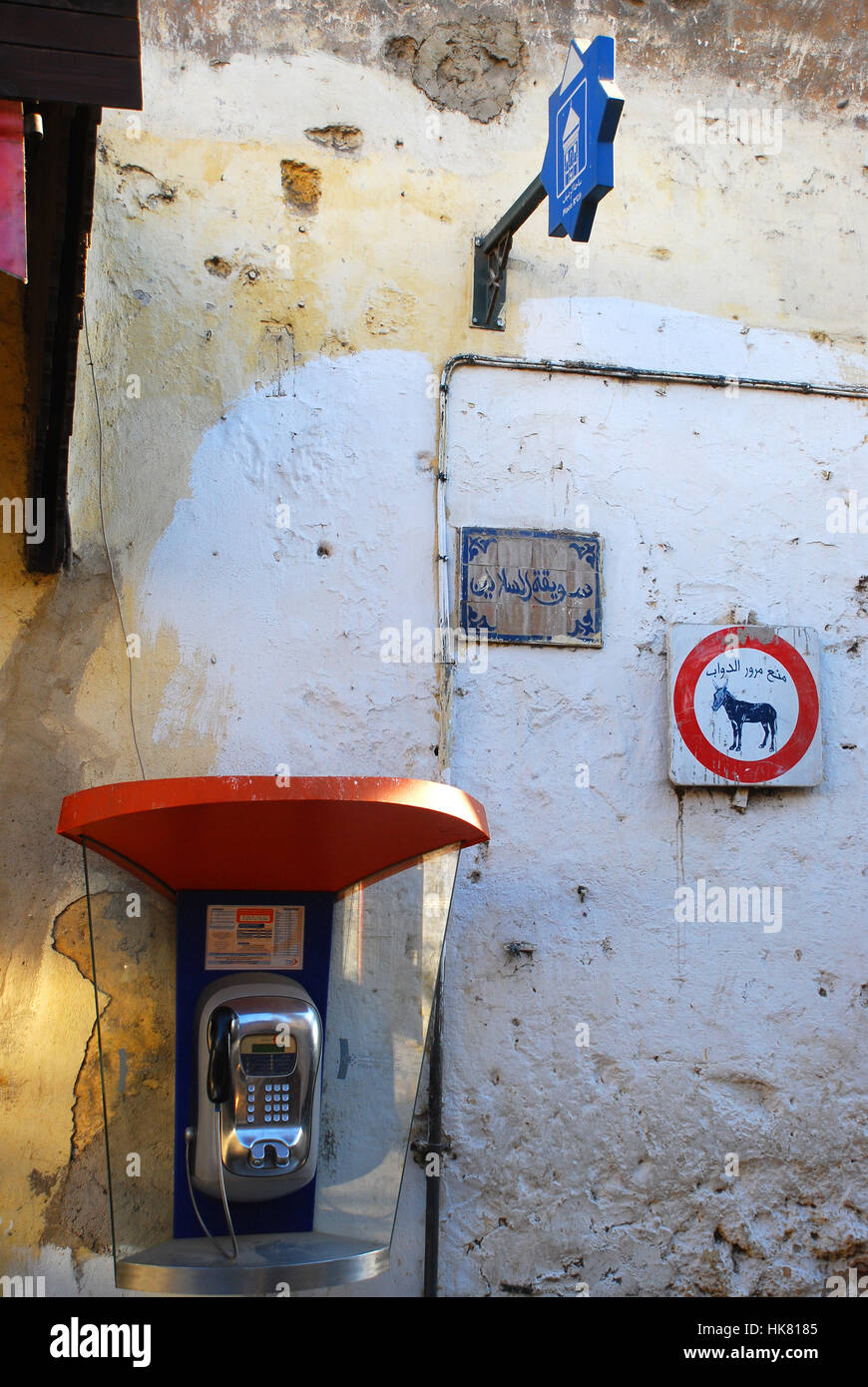Telephone box and traffic sign Morocco Fez Stock Photo - Alamy