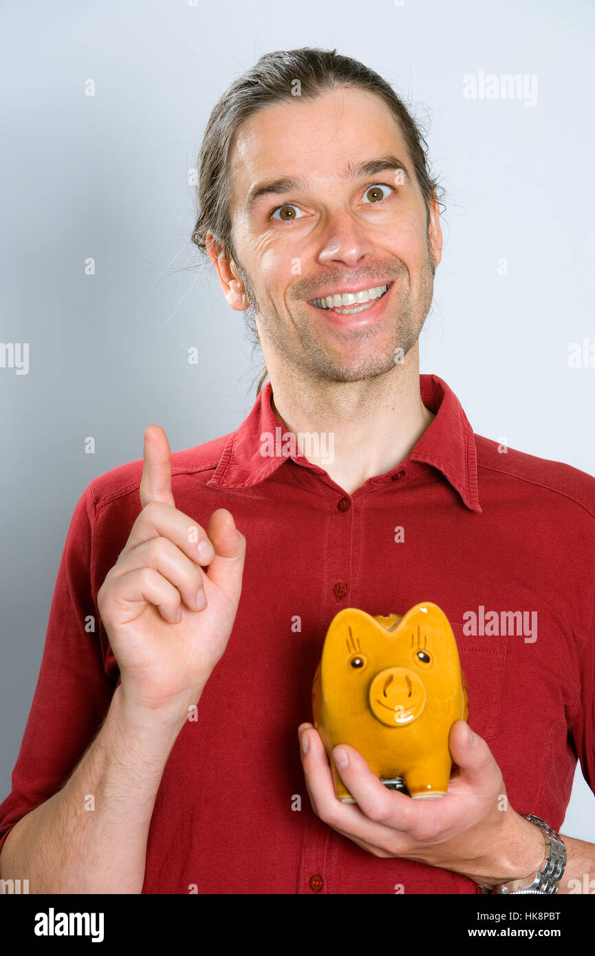 man with piggy bank Stock Photo - Alamy