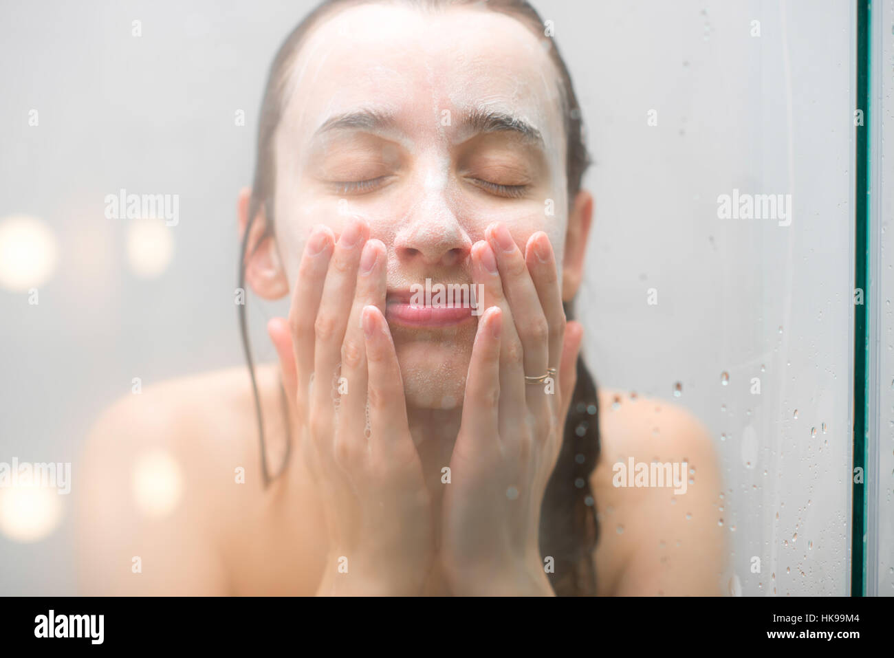 Woman washing face Stock Photo - Alamy