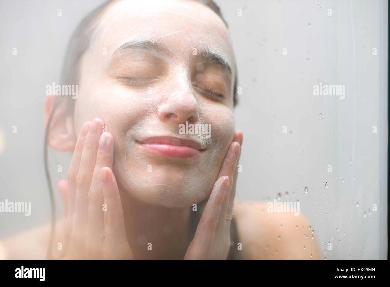 Woman washing face Stock Photo - Alamy