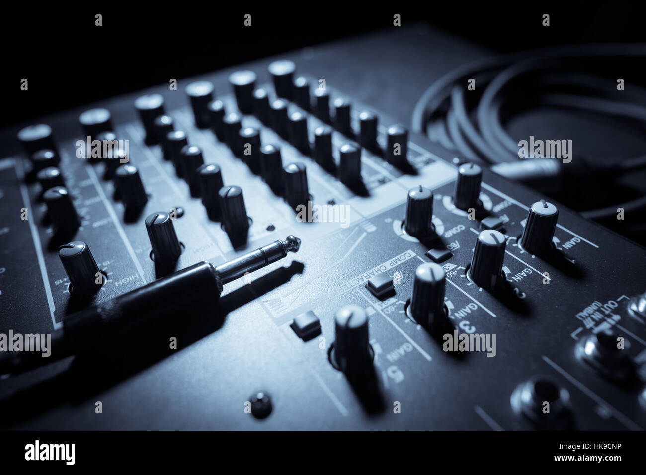 Close up shot of a mixer desk with many buttons and cables Stock Photo ...