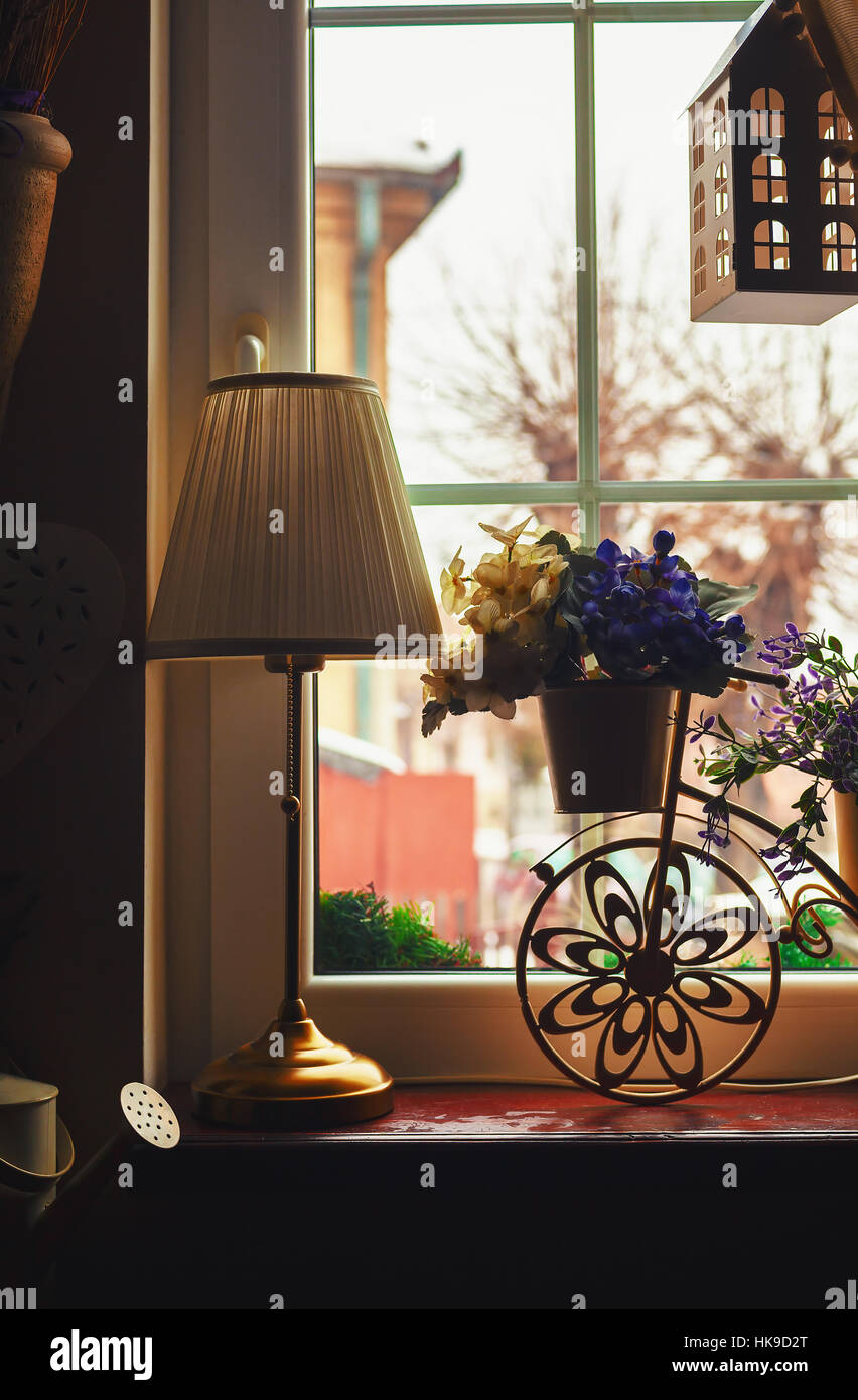 Decorative objects in front of window, indoor details Stock Photo - Alamy