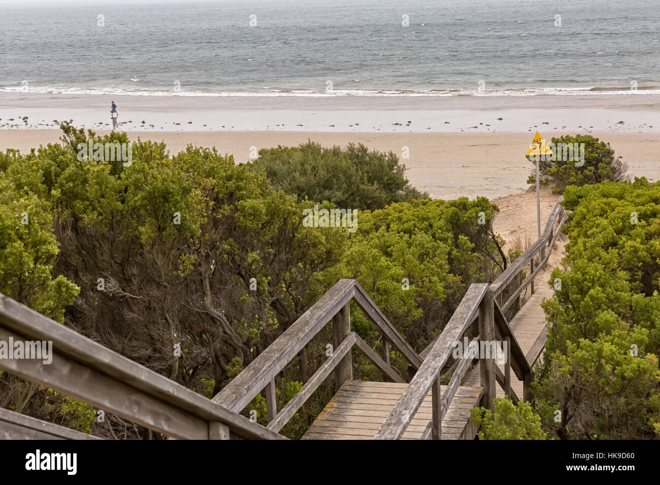 A person walking on the beach of Torquay beach, Victoria, Australia ...
