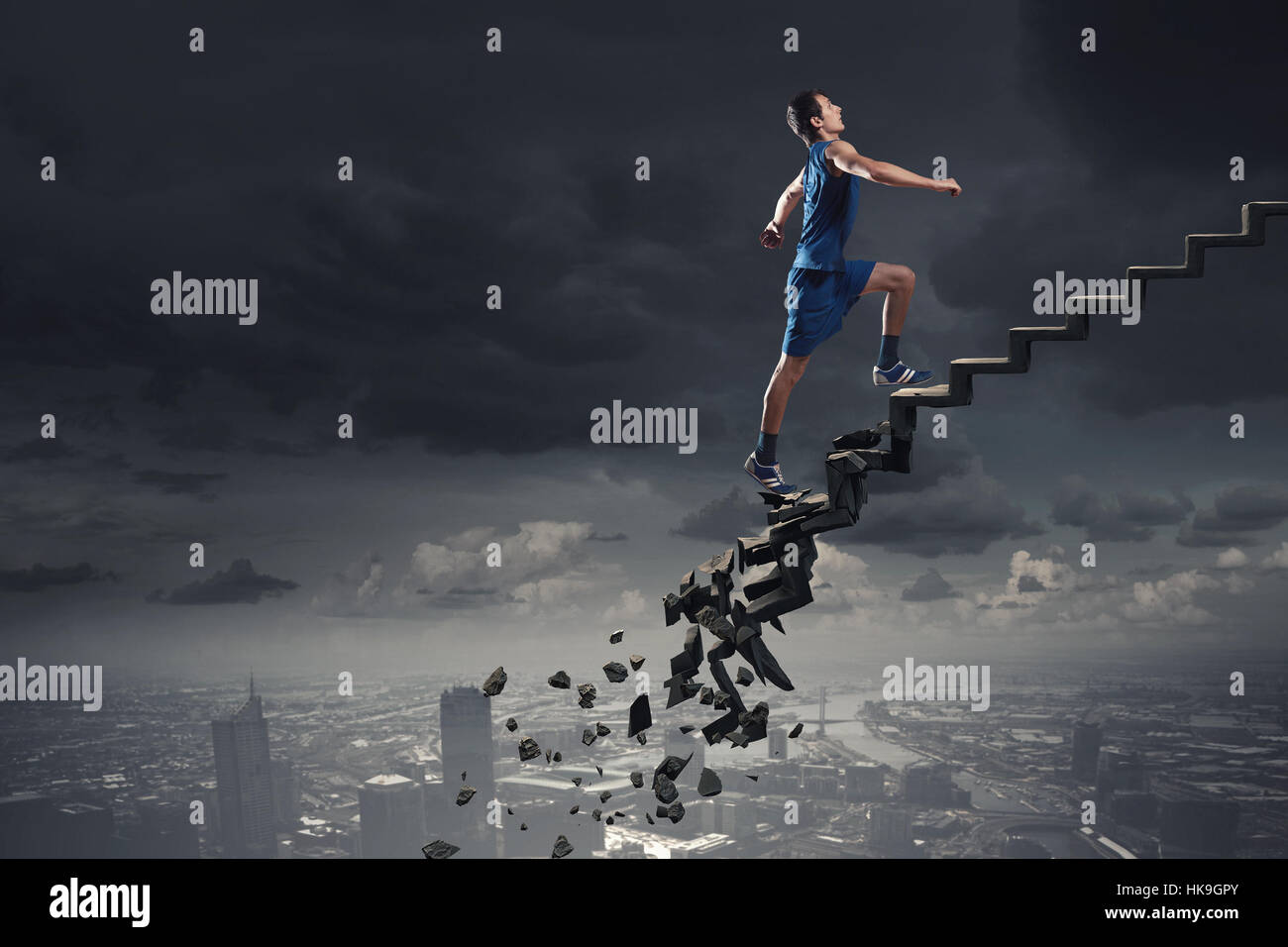Sports active man running on stone collapsing ladder Stock Photo - Alamy