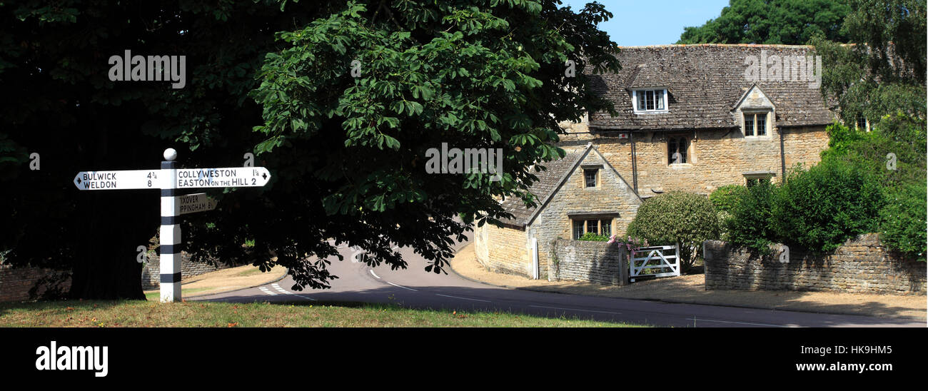 Summer view of stone cottages in Duddington village, Northamptonshire ...