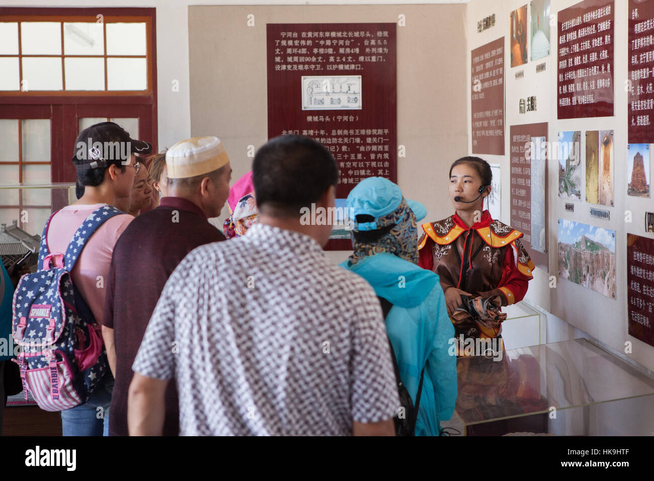 A guide explains the history of the archeological site of Shui Dong Gou ...