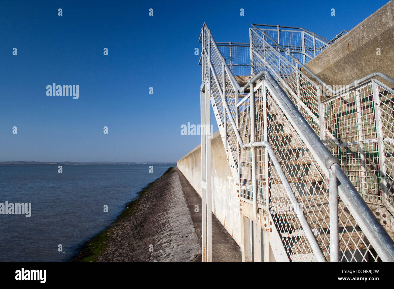Steps over the sea wall on Canvey Island, Essex, England Stock Photo ...