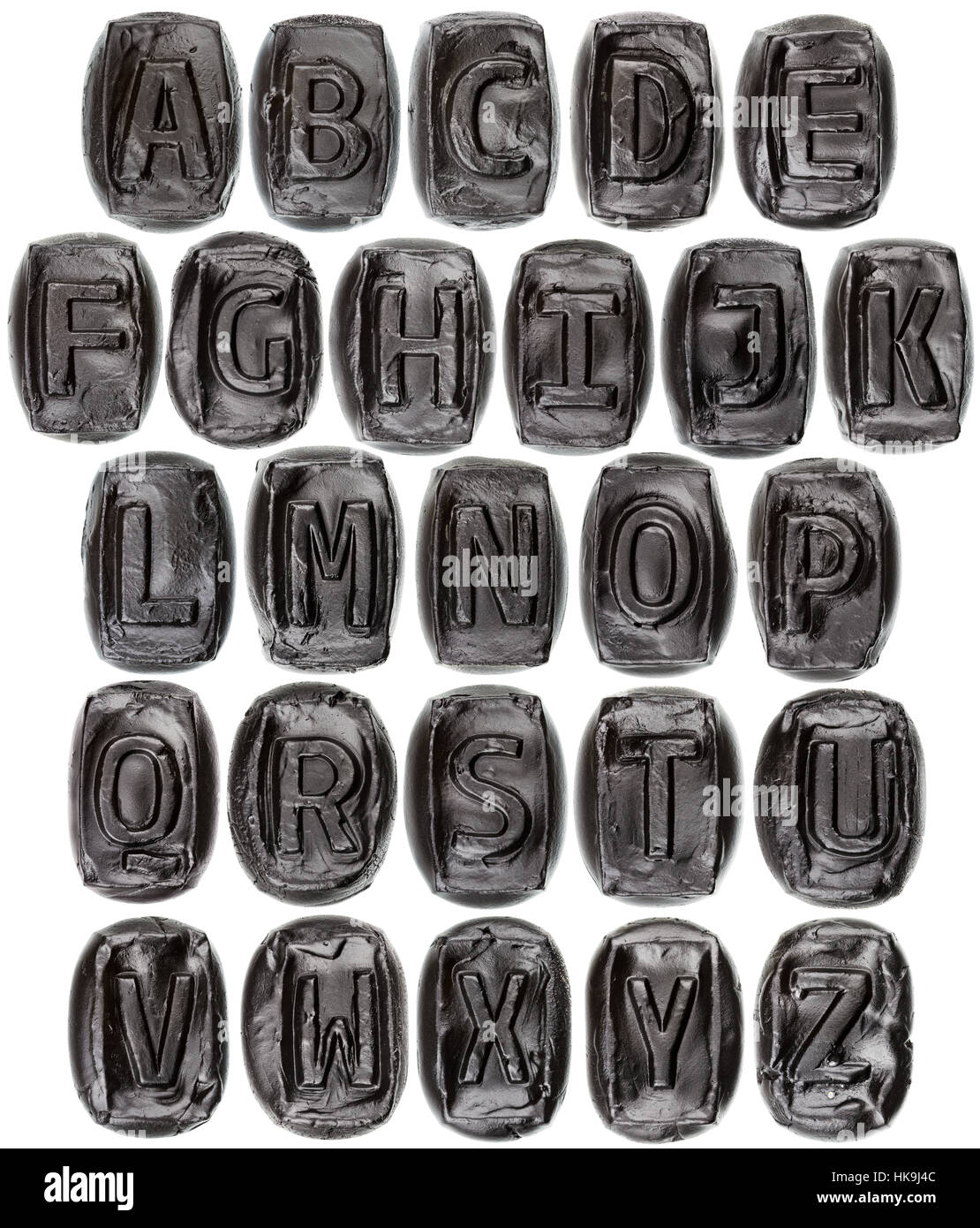 Handmade ceramic letter alphabet painted in black isolated on white ...
