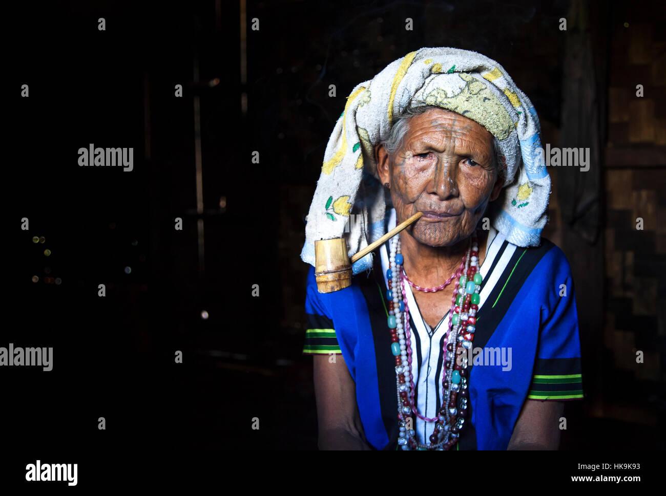 Chin region, Myanmar, November 11, 2014: muun tribe chin lady smoking a ...