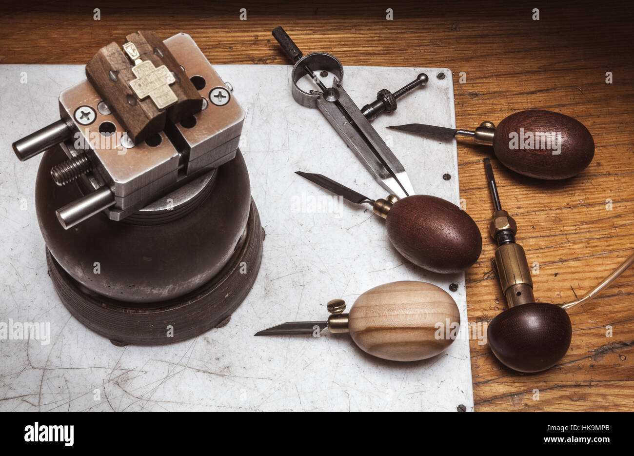 Cross in bullseye vise, gravers and compasses Stock Photo - Alamy