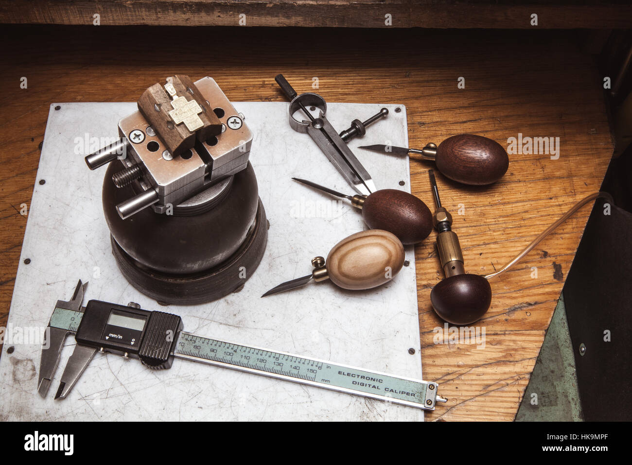 Cross in bullseye vise, gravers and calipers Stock Photo - Alamy