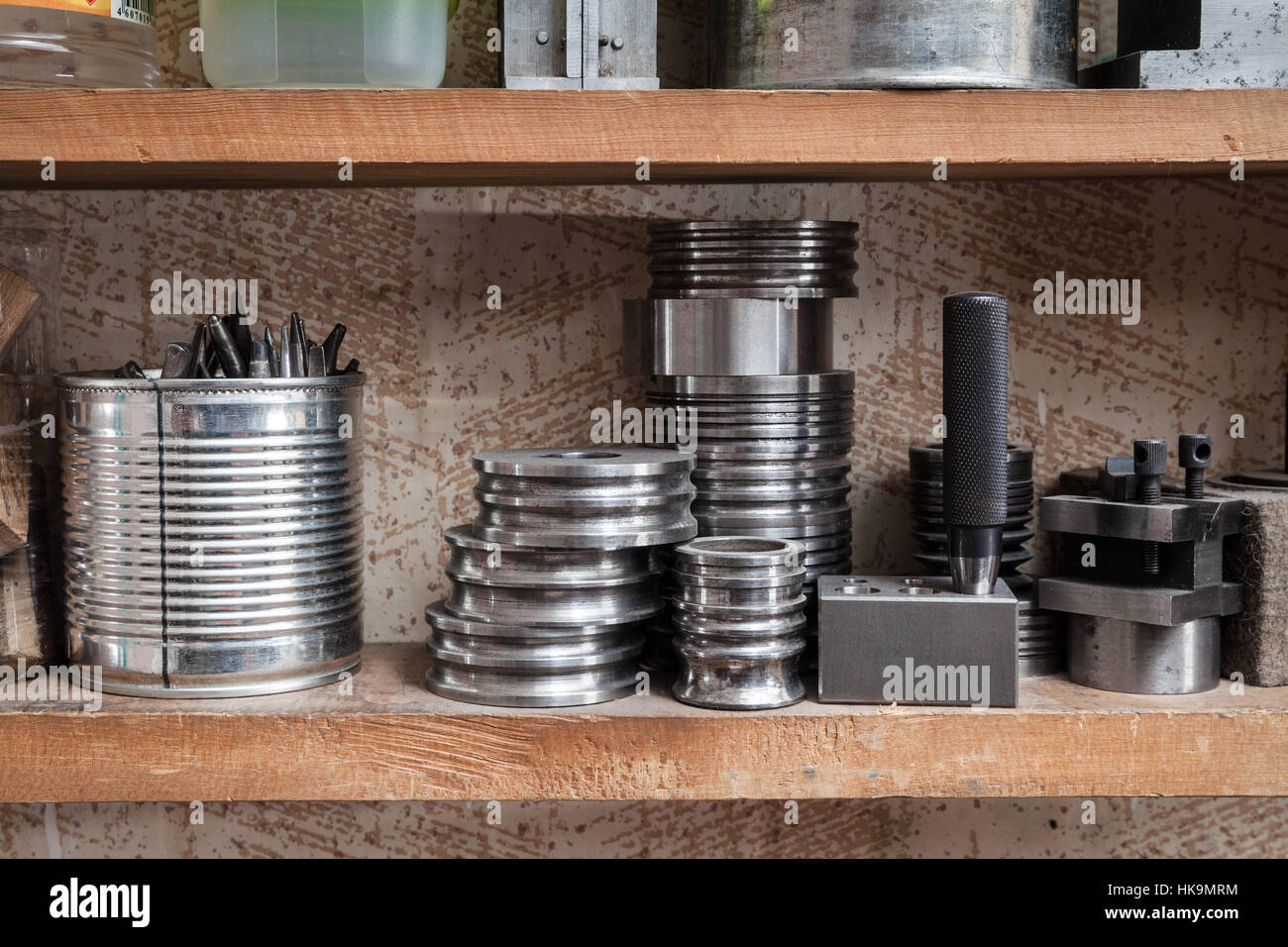 Rolling press details and other tools at shelf Stock Photo - Alamy
