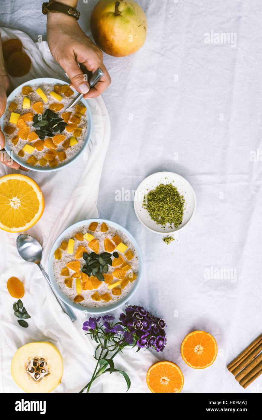 Bulgur breakfast bowls topped with fruit and pepitas photographed from ...