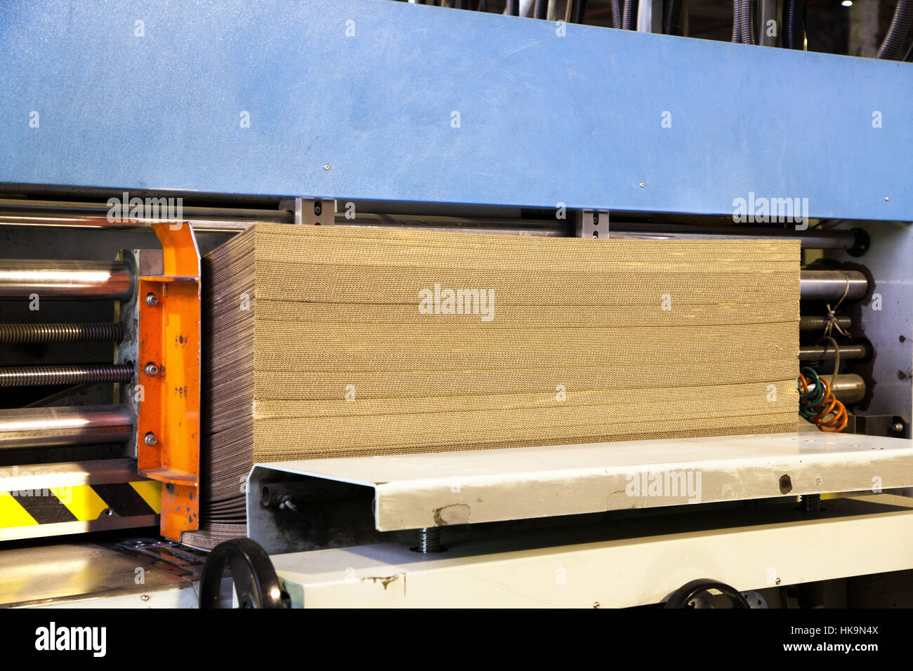 Cardboard manufacture machine with cardboard stack Stock Photo - Alamy
