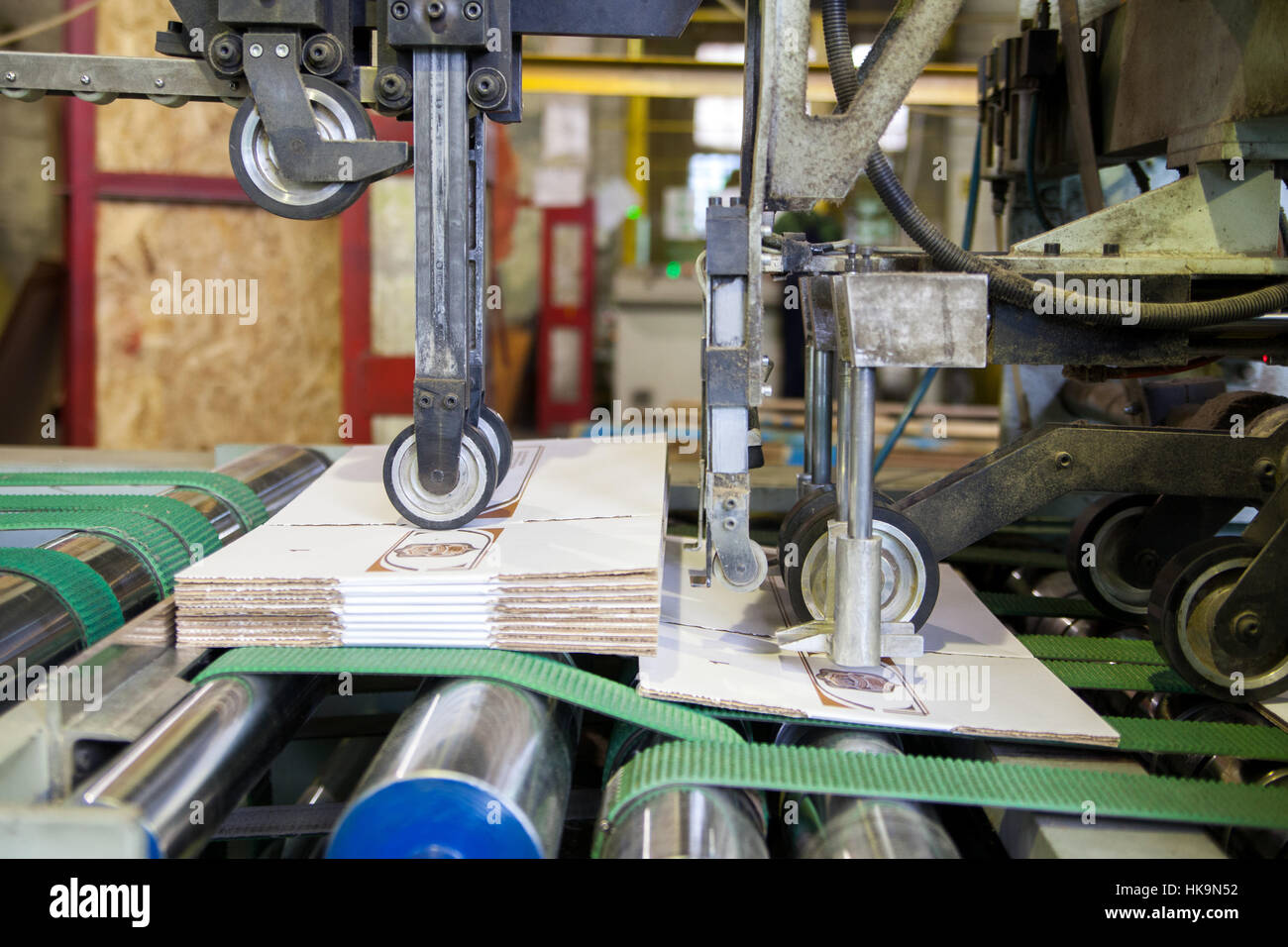 Cardboard manufacture machine propduct line making boxes Stock Photo ...