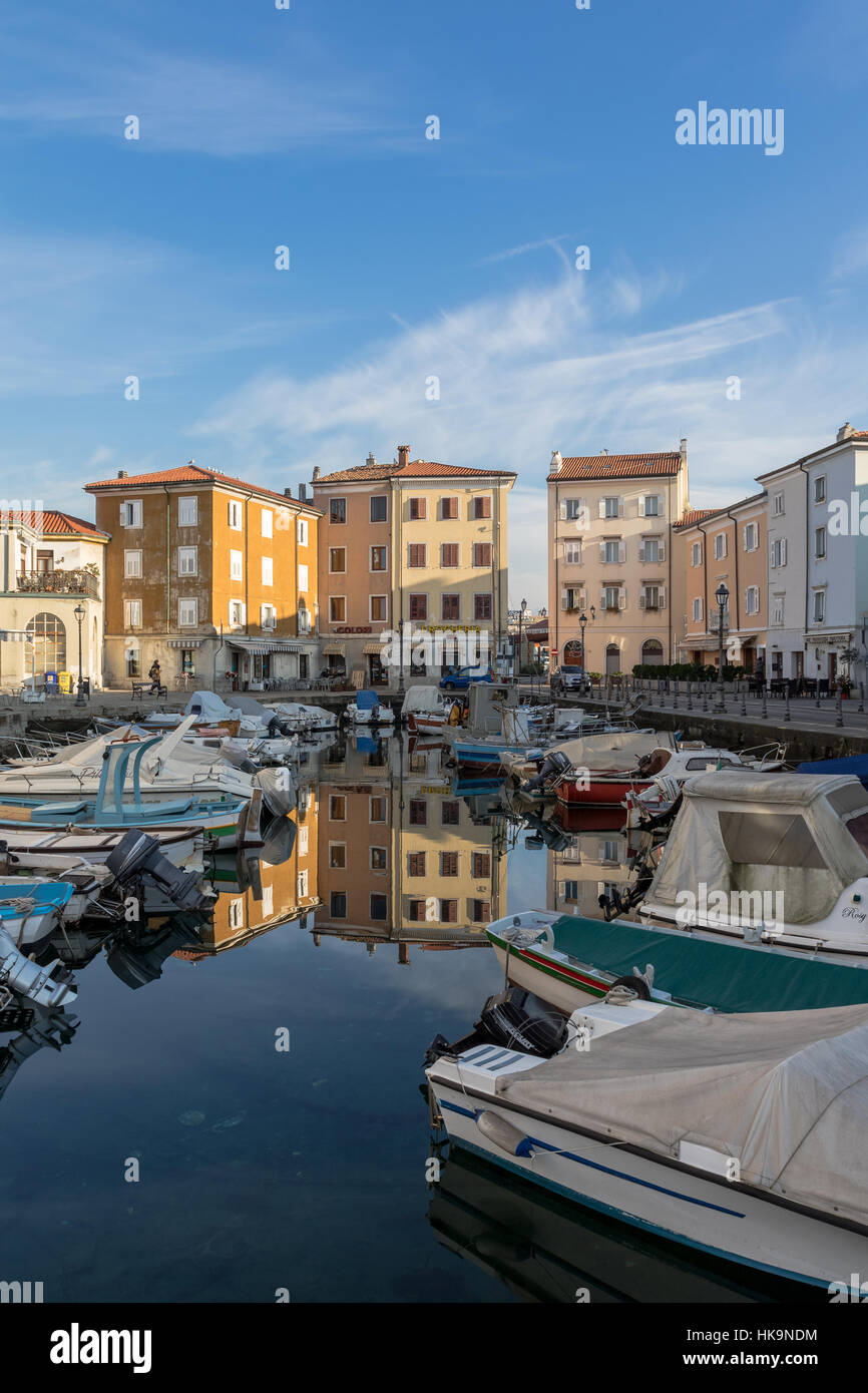 Boats moored in old port of Muggia, Italy Stock Photo - Alamy