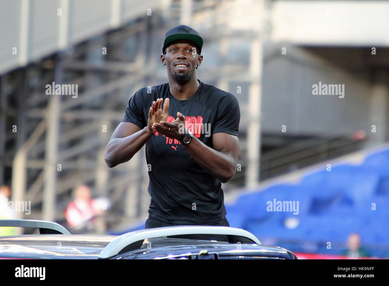 Usain Bolt of Jamaica being presented to the crowd before the start of ...