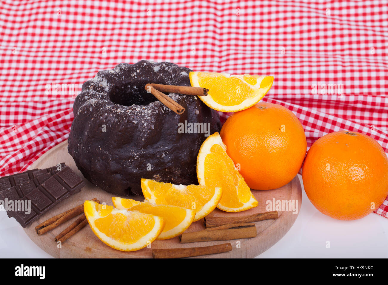 Very tasty chocolate cake with orange on a wooden base Stock Photo - Alamy